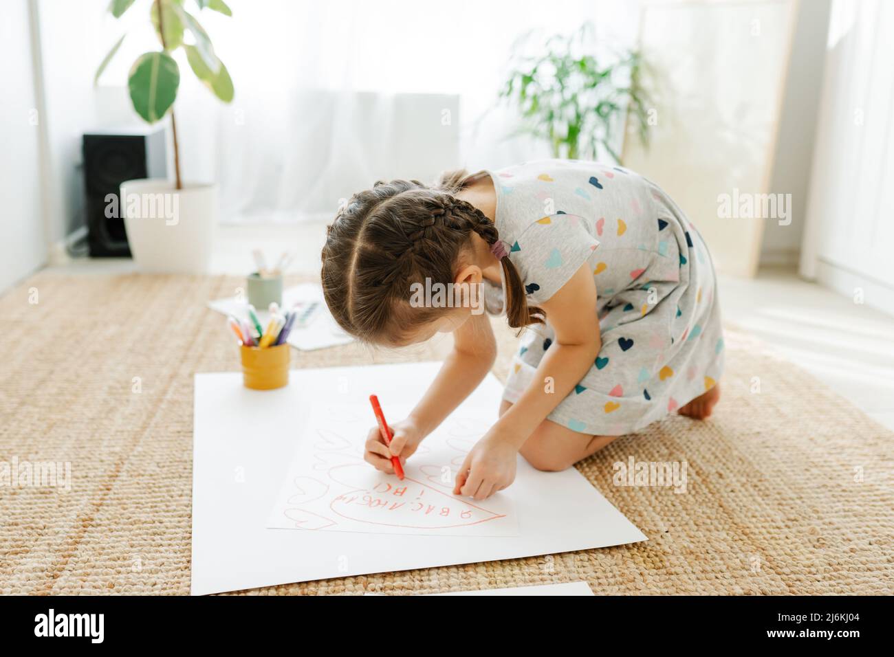 Child drawing a lot of hearts Stock Photo - Alamy
