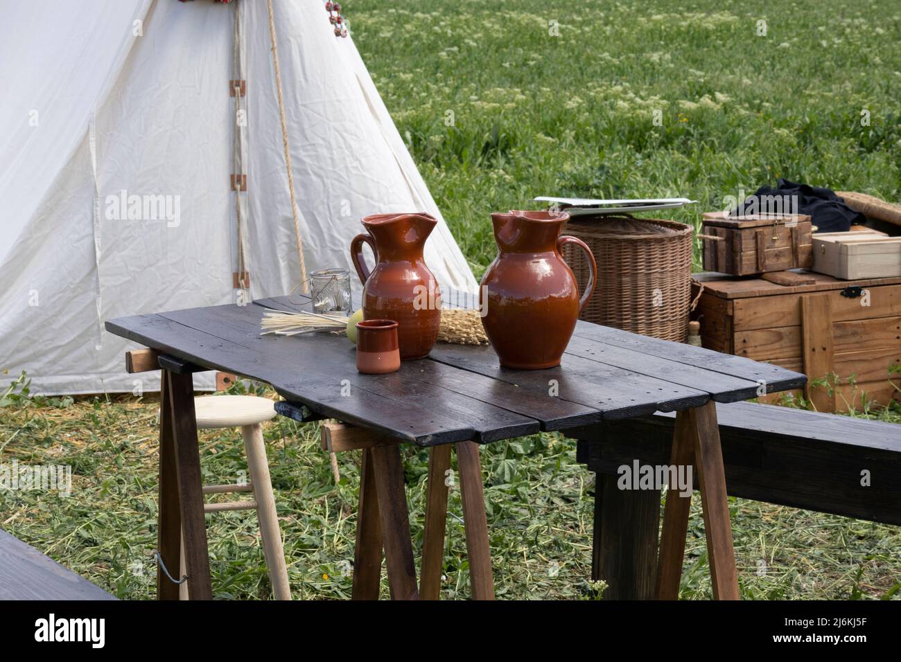 medieval picnic area with ceramic pots and wooden table Stock Photo - Alamy