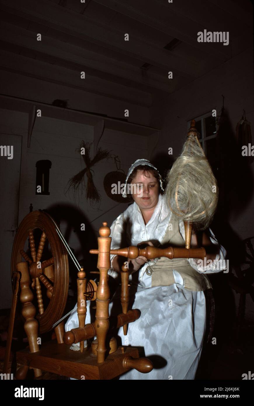 Williamsburg, VA. U.S.A. 9/1987. Colonial loom and spinning wheel ...