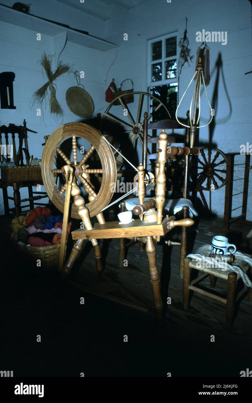 Williamsburg, VA. U.S.A. 9/1987. Colonial loom and spinning wheel ...