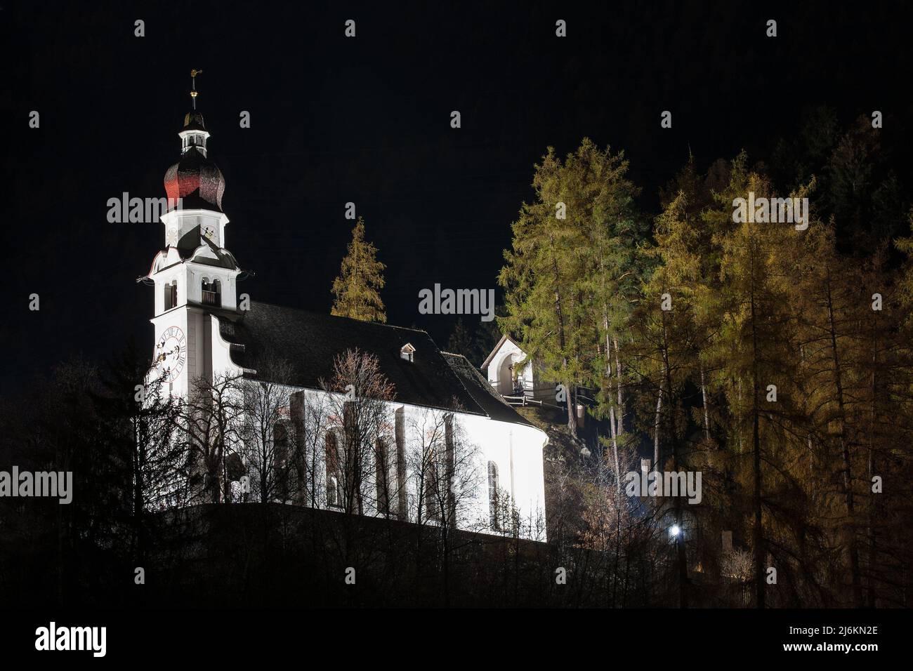 High above the small village of Rietz in Tyrol, shines illuminated by ...