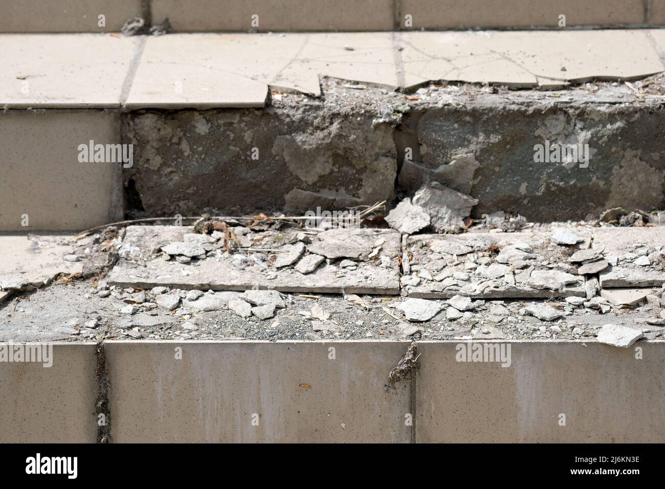Steps with broken tiles on top. The tiles fell off the stairs. The old ...