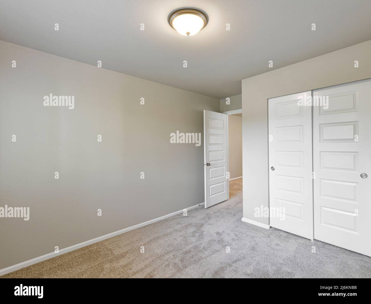 Modern residential empty bedroom interior Stock Photo - Alamy