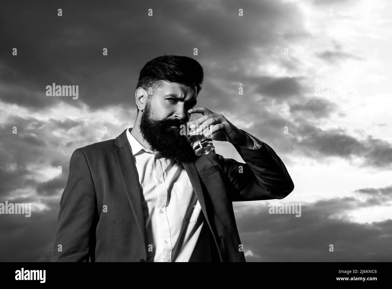 Bearded man glass whiskey Black and White Stock Photos & Images - Alamy