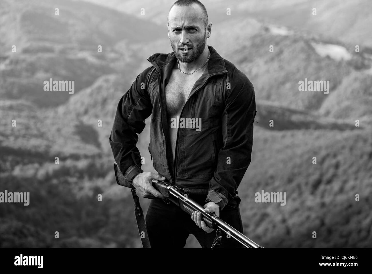 American hunting rifles. Male with a gun. Handsome hunter man holding ...
