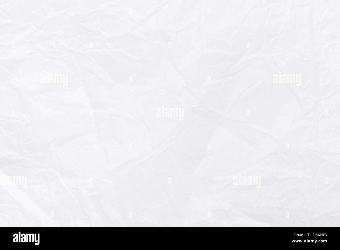 White crumpled wrapping paper texture close up. The paper background ...