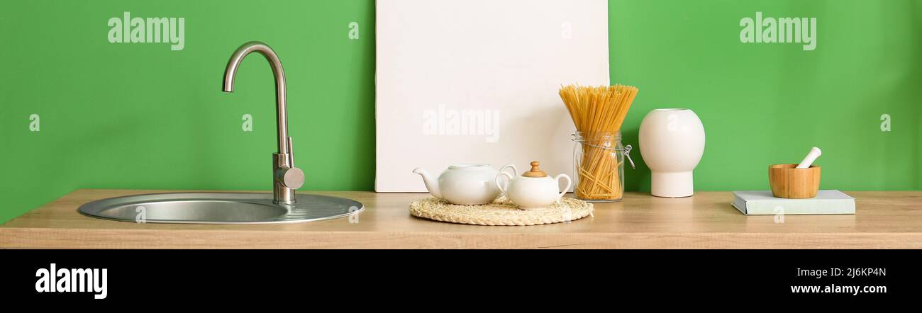 Counter with sink and utensils in interior of stylish kitchen Stock ...