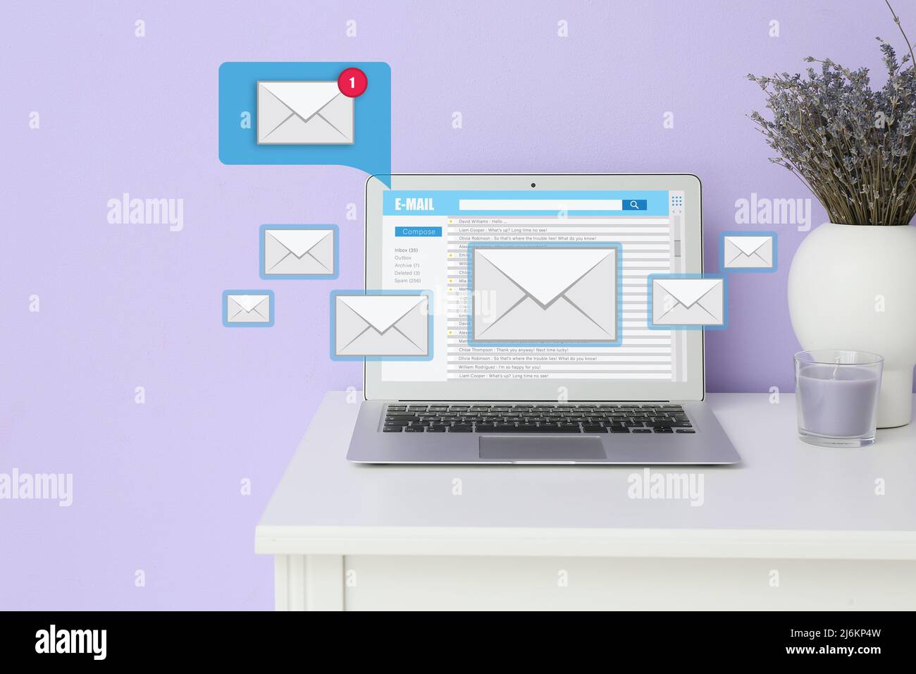 Modern laptop with symbols of new unread messages on screen at ...