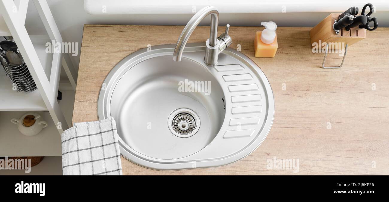 Wooden counter with metal sink in kitchen, top view Stock Photo - Alamy