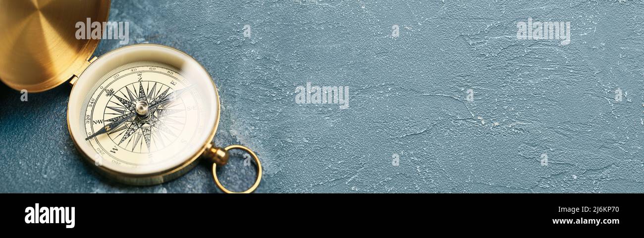 Vintage compass on grey background with space for text Stock Photo - Alamy