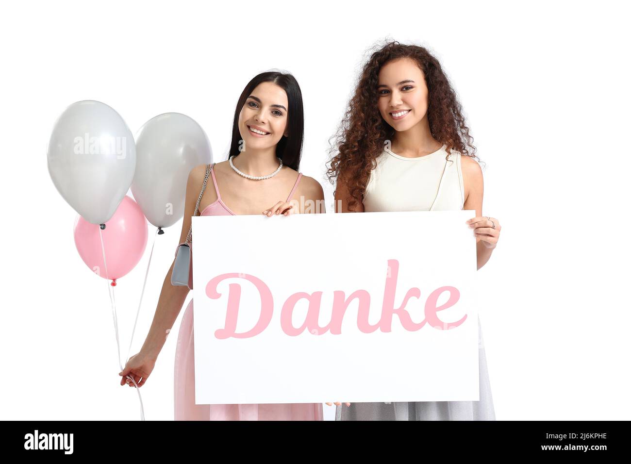 Beautiful young women holding paper with word DANKE (German for Thanks ...