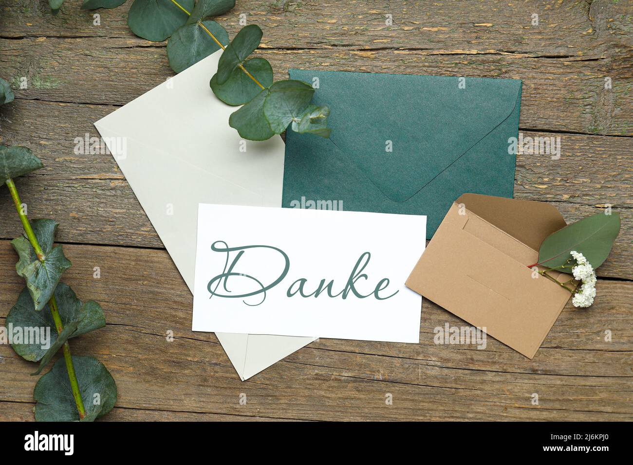 Card with word DANKE (German for Thanks), envelopes and eucalyptus ...