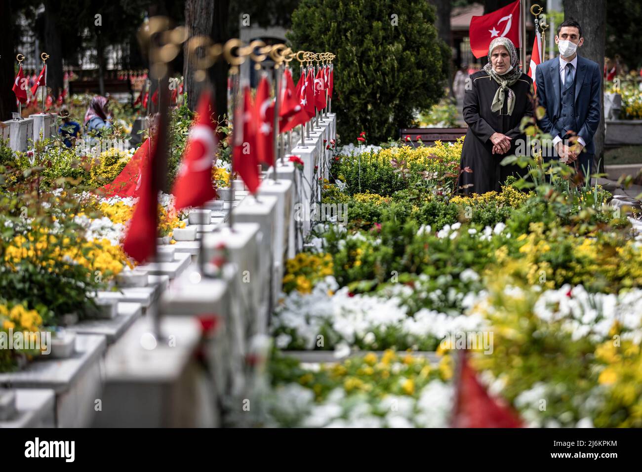 Istanbul, Turkey - 2 May 2022, People are seen at the grave of a loved ...