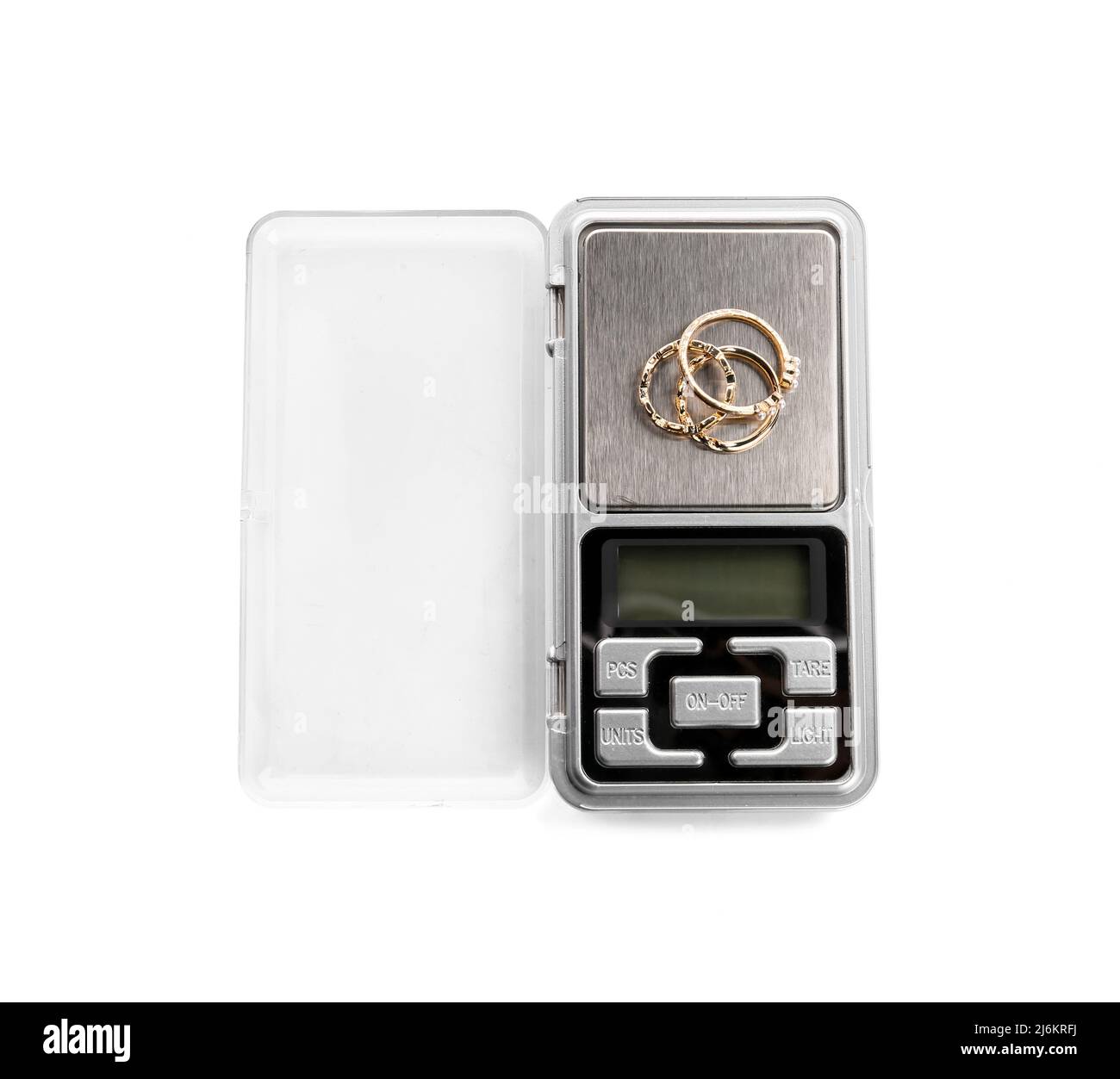 Jewelry scales with rings on white background Stock Photo - Alamy