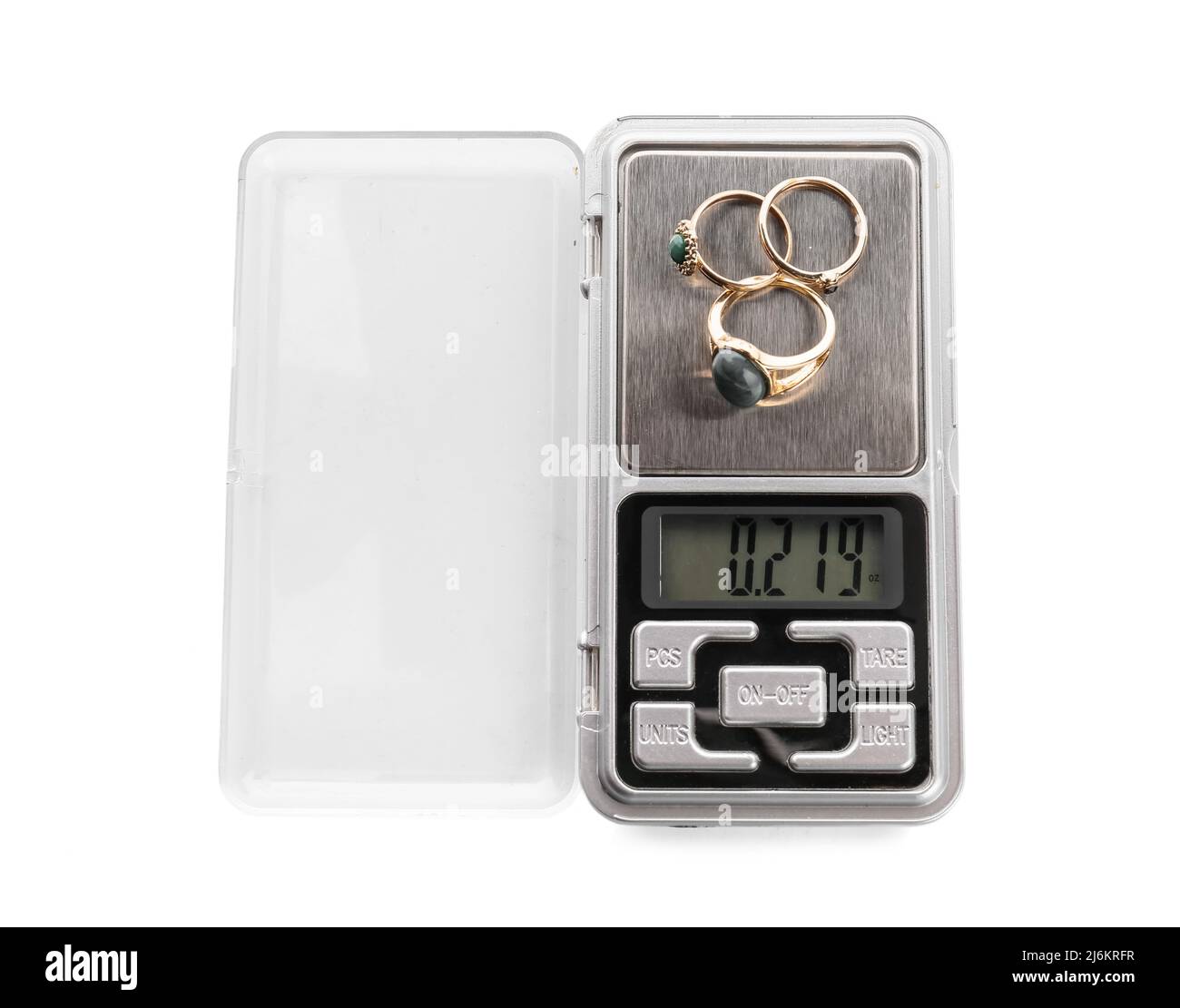 Jewelry scales with rings on white background Stock Photo - Alamy
