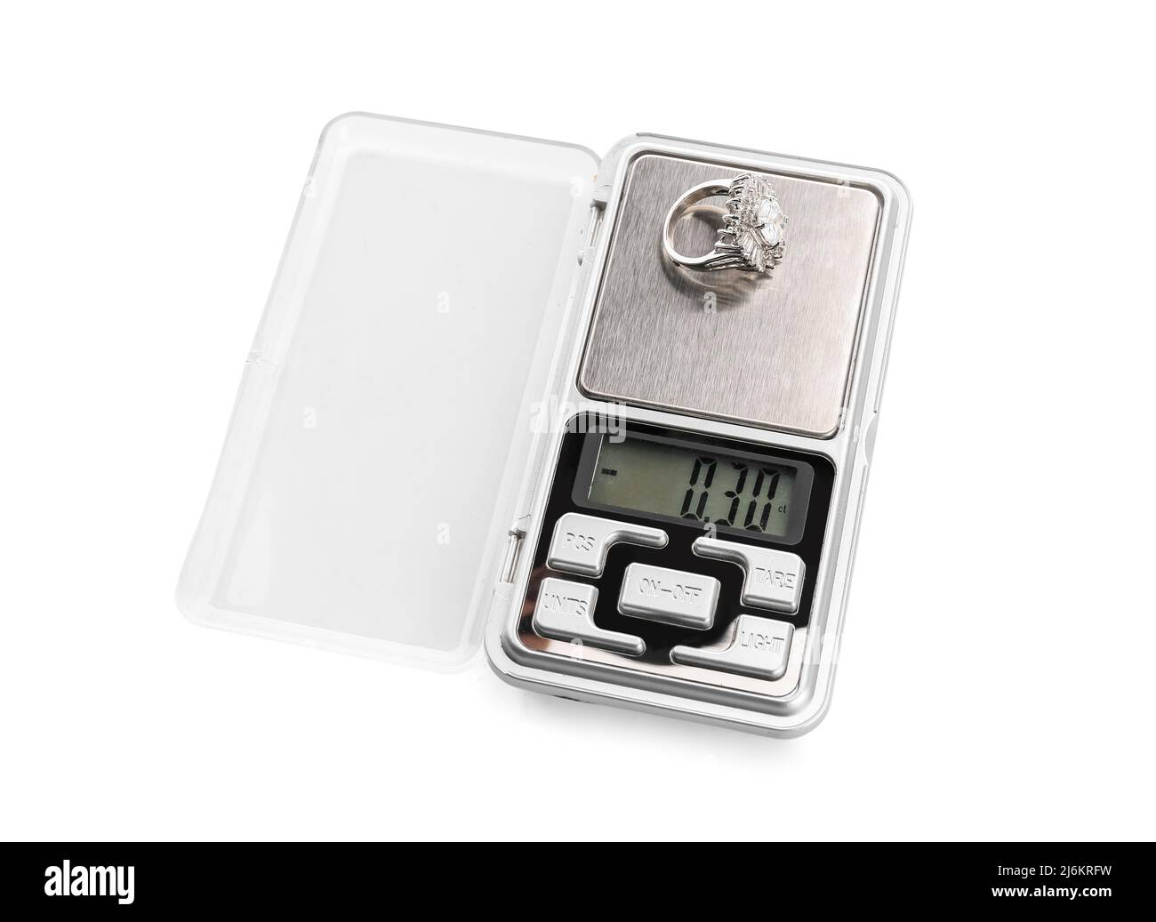 Jewelry scales with ring on white background Stock Photo - Alamy