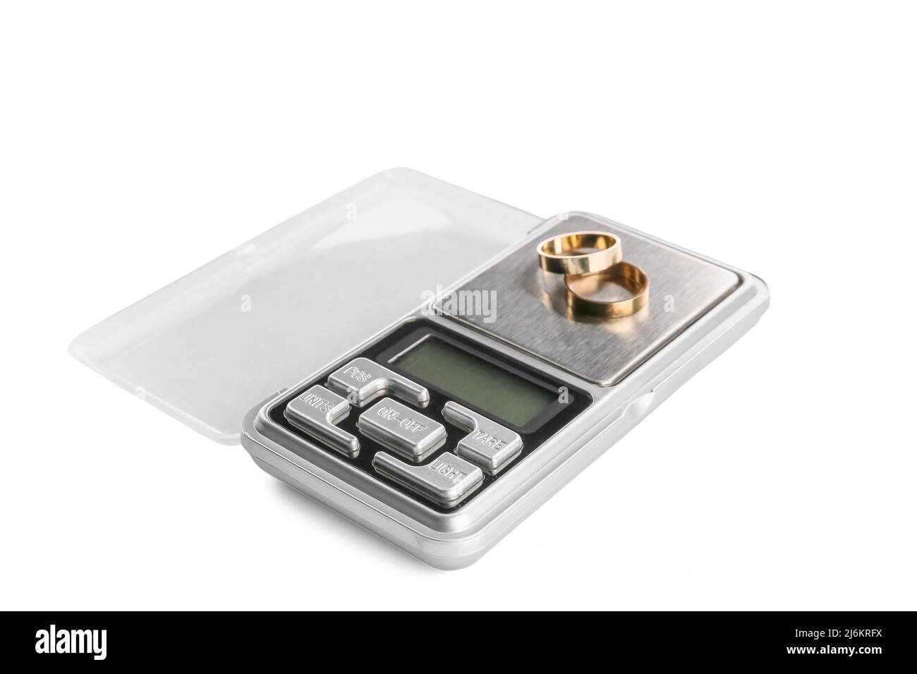 Jewelry scales with rings on white background Stock Photo - Alamy