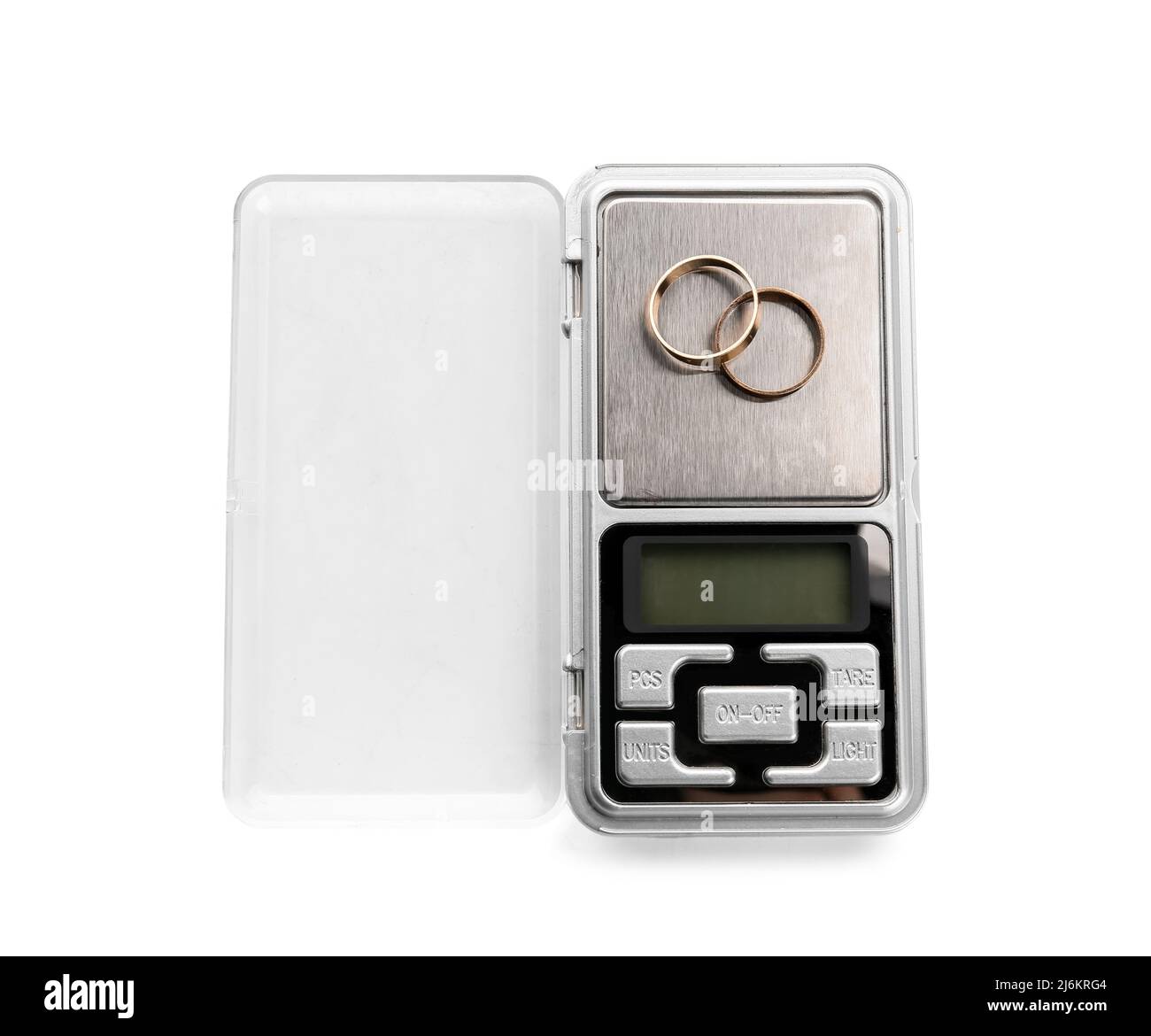 Jewelry scales with rings on white background Stock Photo - Alamy