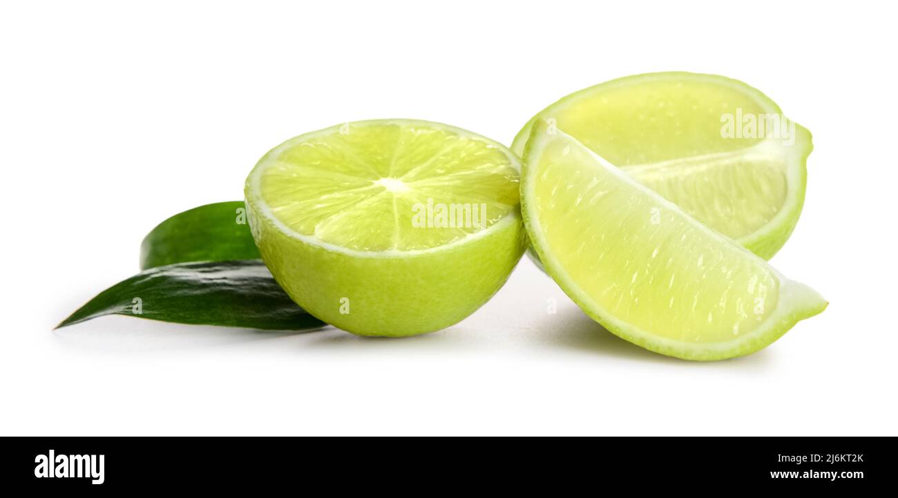 Cut limes on white background Stock Photo - Alamy