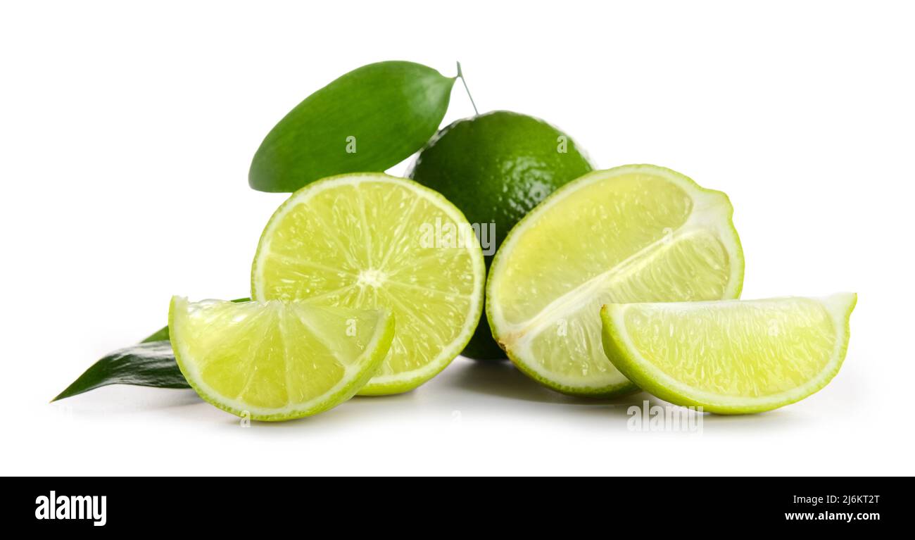 Cut limes on white background Stock Photo - Alamy