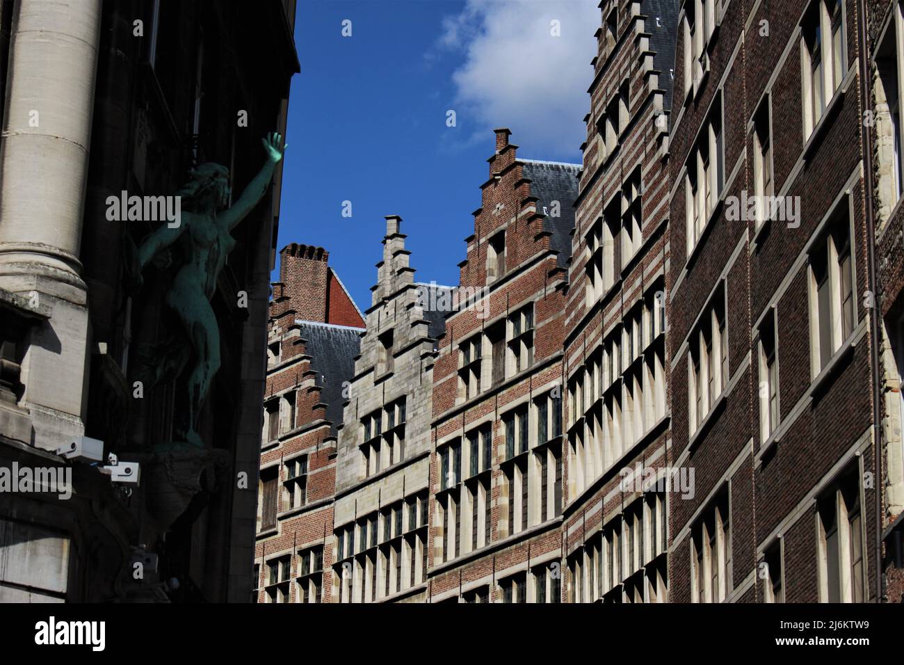 Curving street with typical Flemish Architecture in Antwerp, Belgium ...