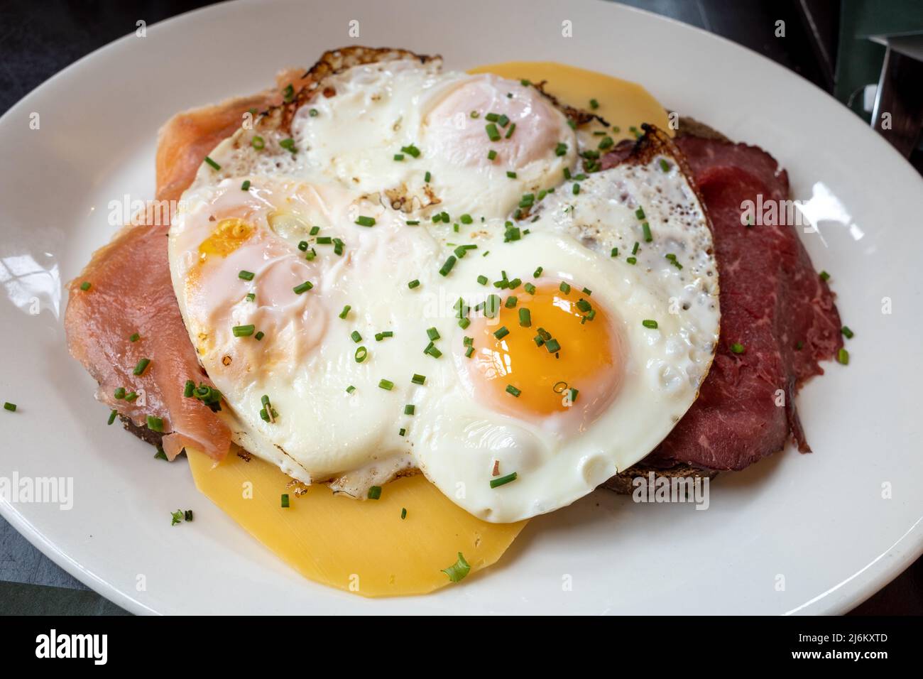 Uitsmijter, traditional dutch breakfast, lunch or bunch, fry egg with ...
