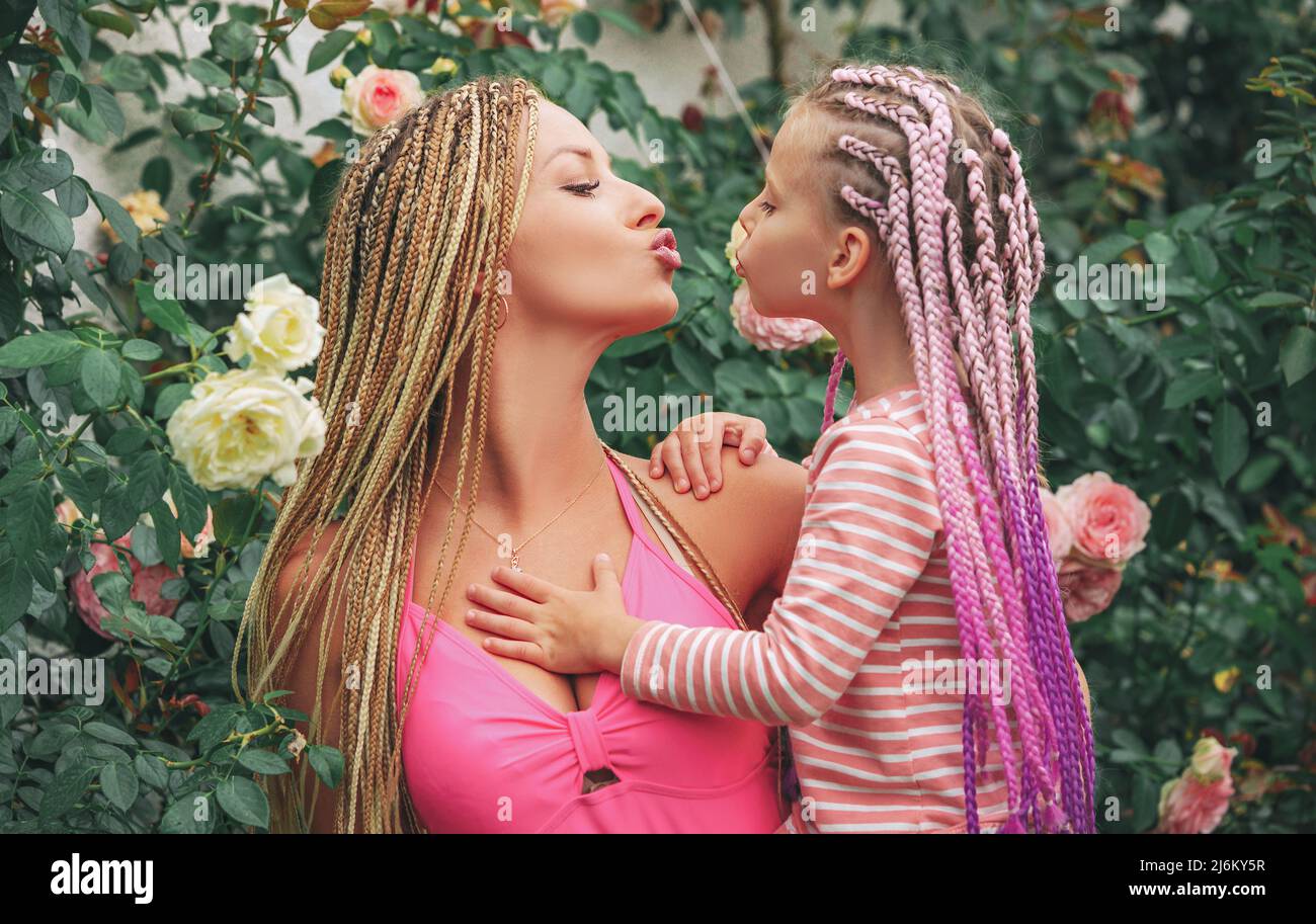 Happy family mother and child daughter hugging and kissing. Happy mother hugging her daughter ...