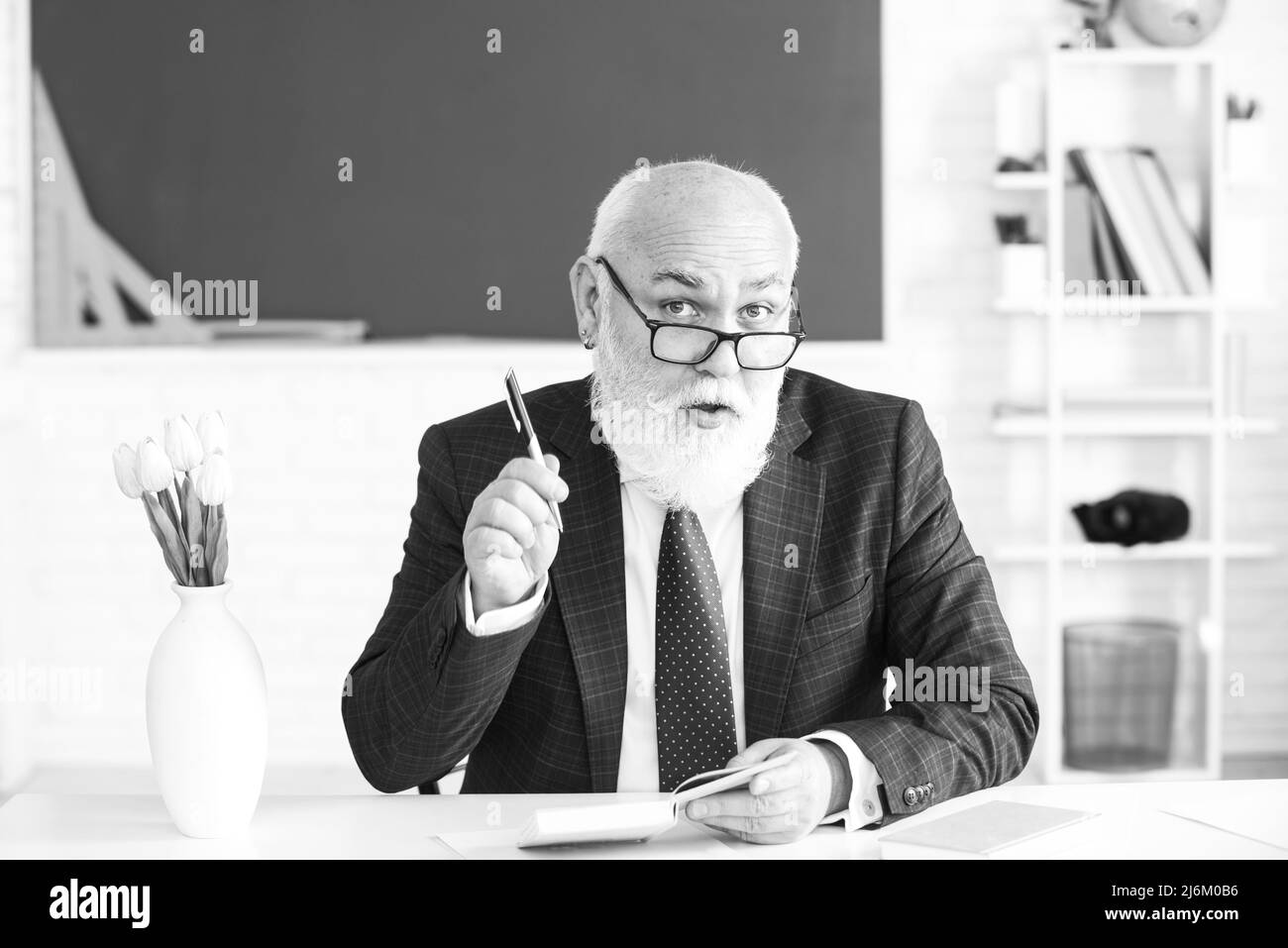 Academic professor holding book Black and White Stock Photos & Images ...