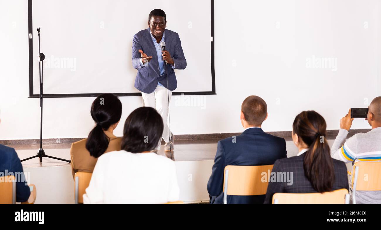 Emotional aframerican business coach giving motivational training Stock ...