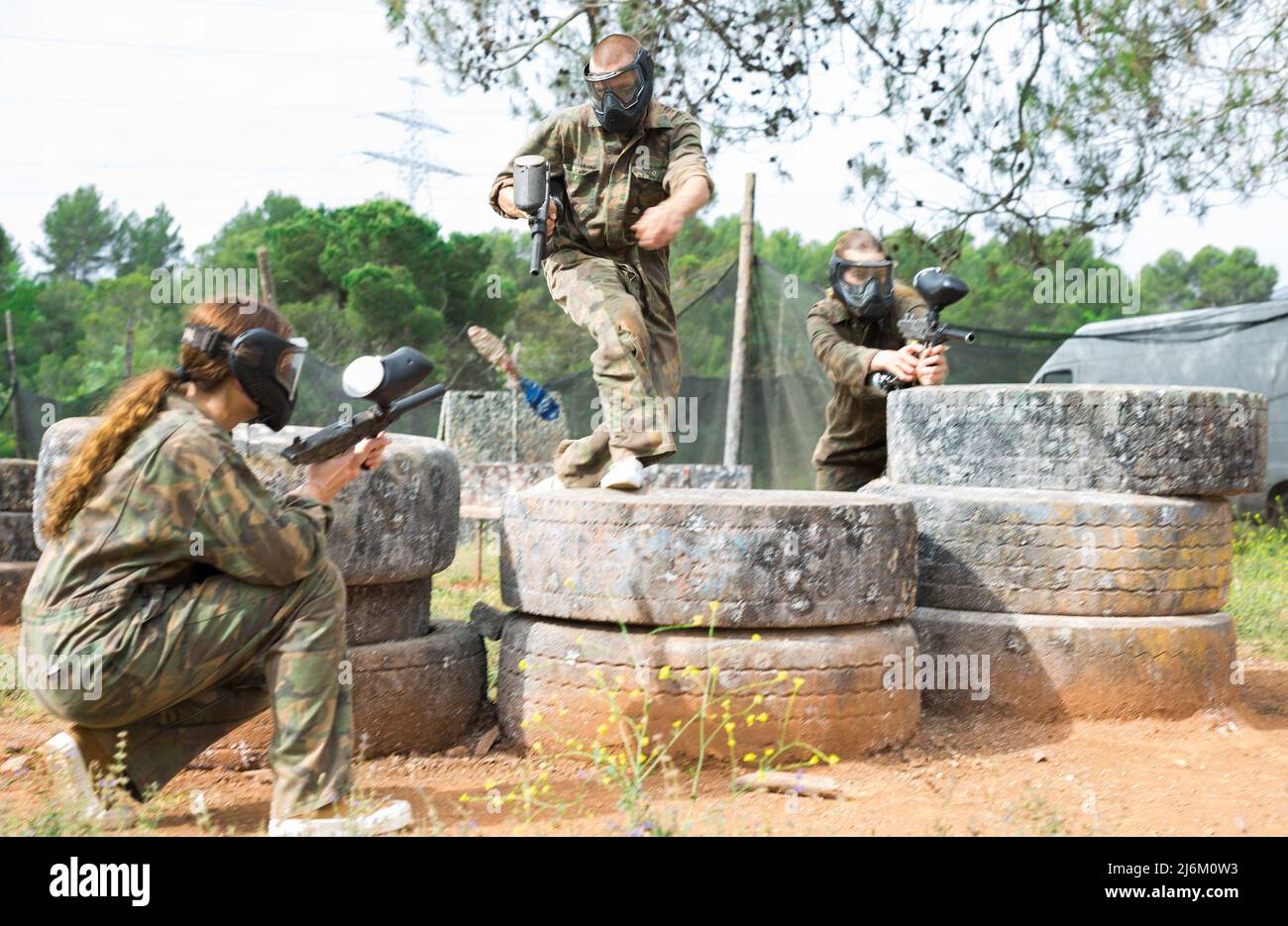Two active opposing teams with guns playing paintball Stock Photo - Alamy Two active opposing teams with guns playing paintball Stock Photo - Alamy