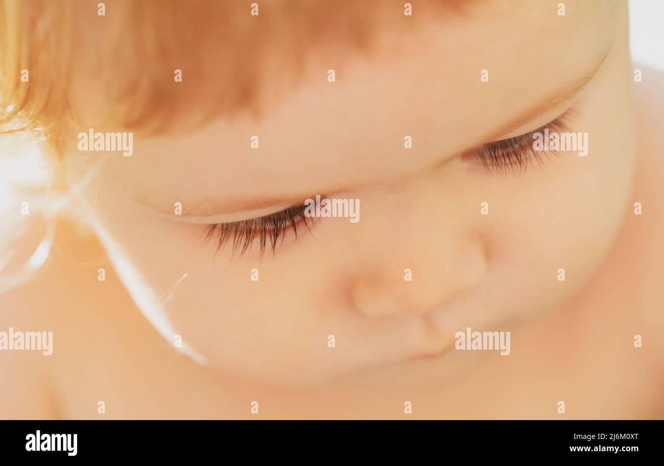 Kids portrait, close up head of cute baby child with long lashes ...