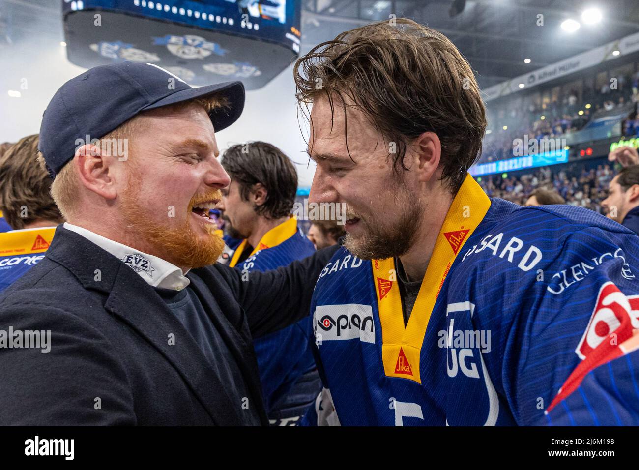 Simon Pfister and Christian Djoos #5 (EV Zug) during the National ...