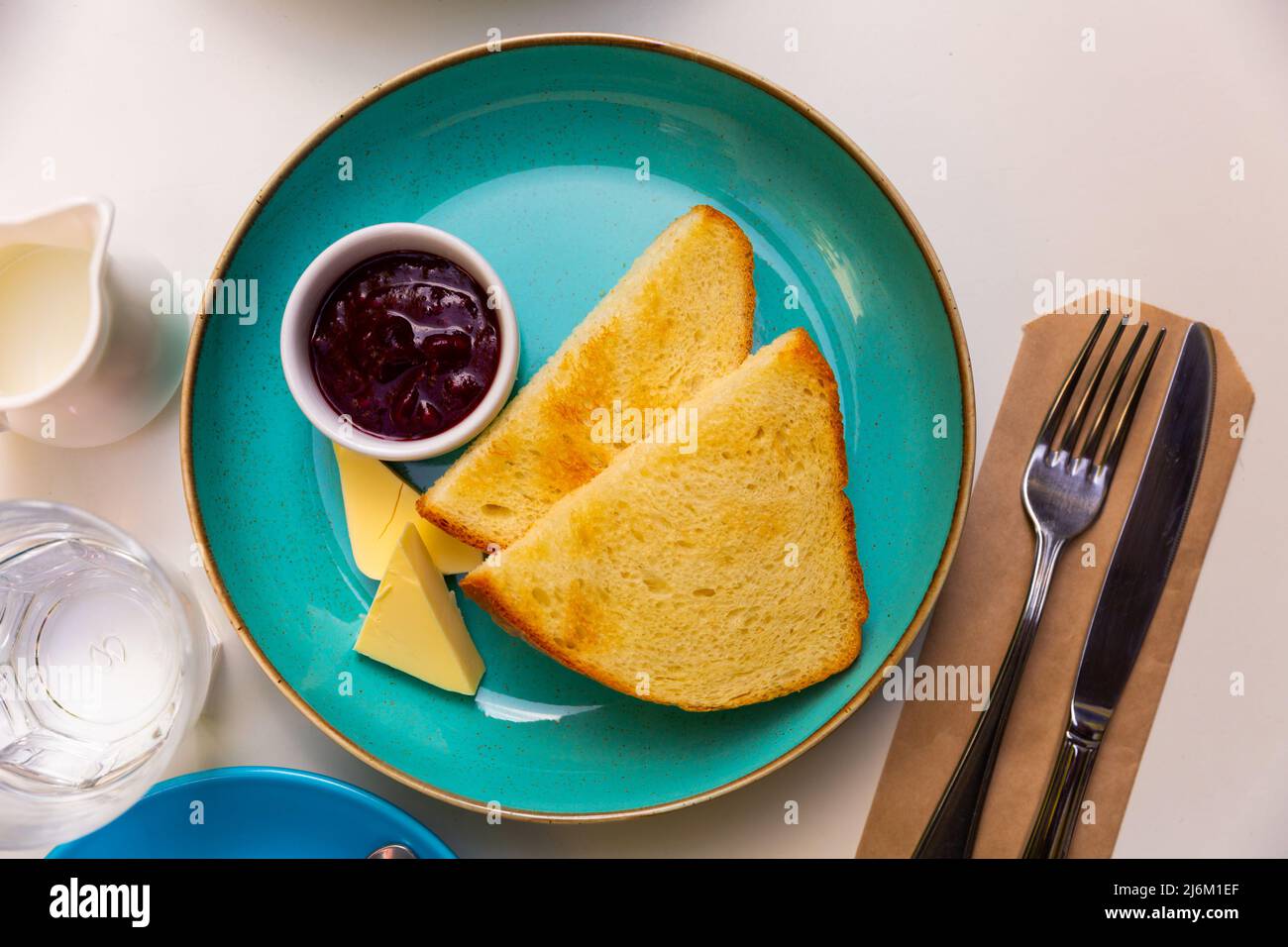 Golden toasts jam and cheese on table. Delicious breakfast Stock Photo ...