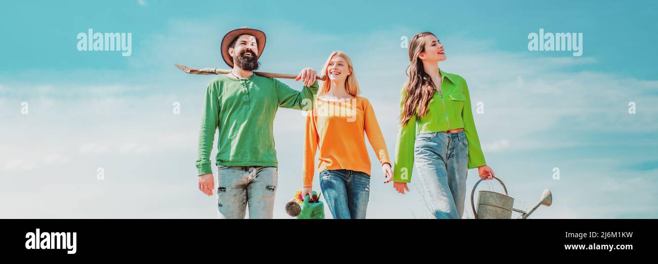 A group of friends enjoy the spring nature and take care of the plants ...