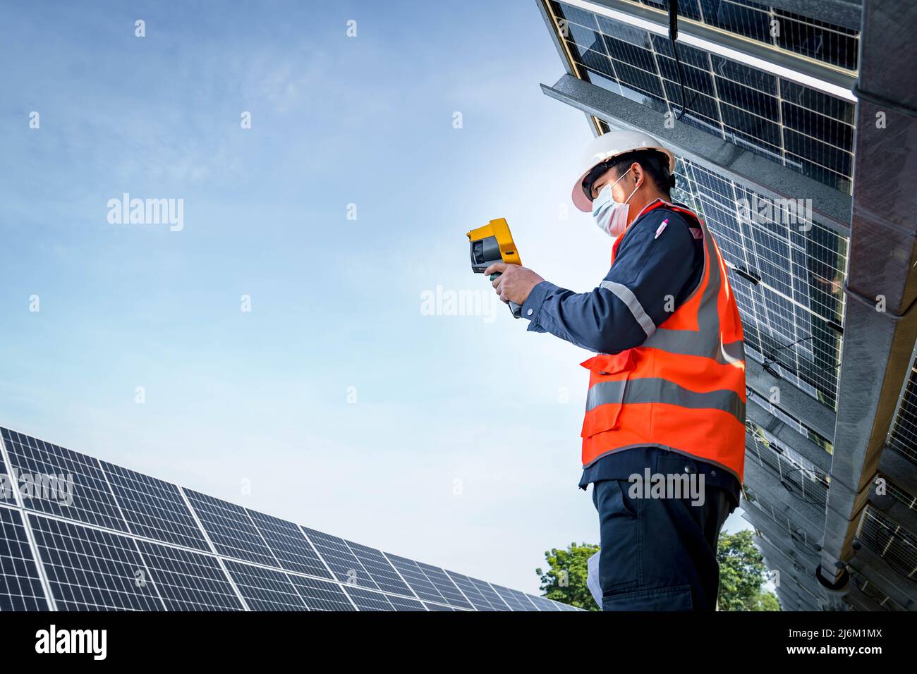 The technician takes the Thermoscan(thermal image camera) scan to the ...