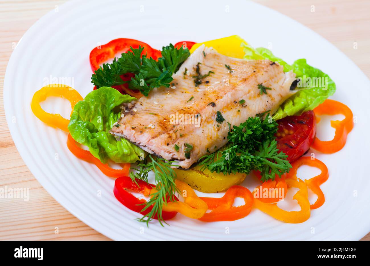 Fried trout fillets with vegetables Stock Photo - Alamy