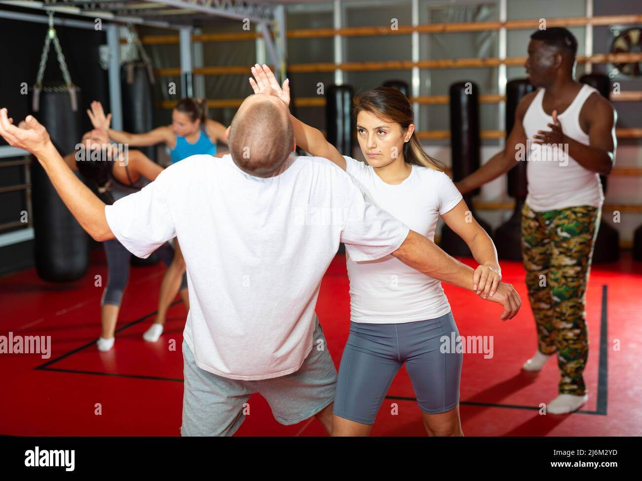 Girl self defense training gym learning to do painful grip Stock Photo ...