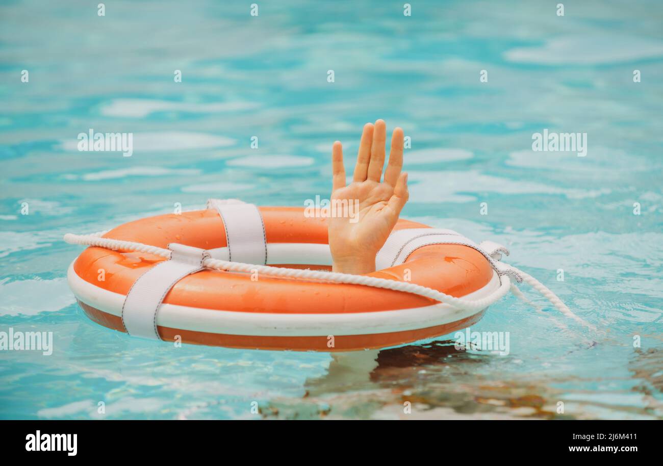 Water rescue emergency equipment. Rescue swimming ring. Drowning person ...