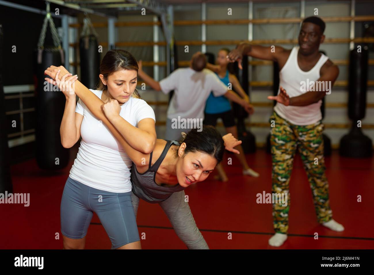 Women exercising during group self-defense training Stock Photo - Alamy
