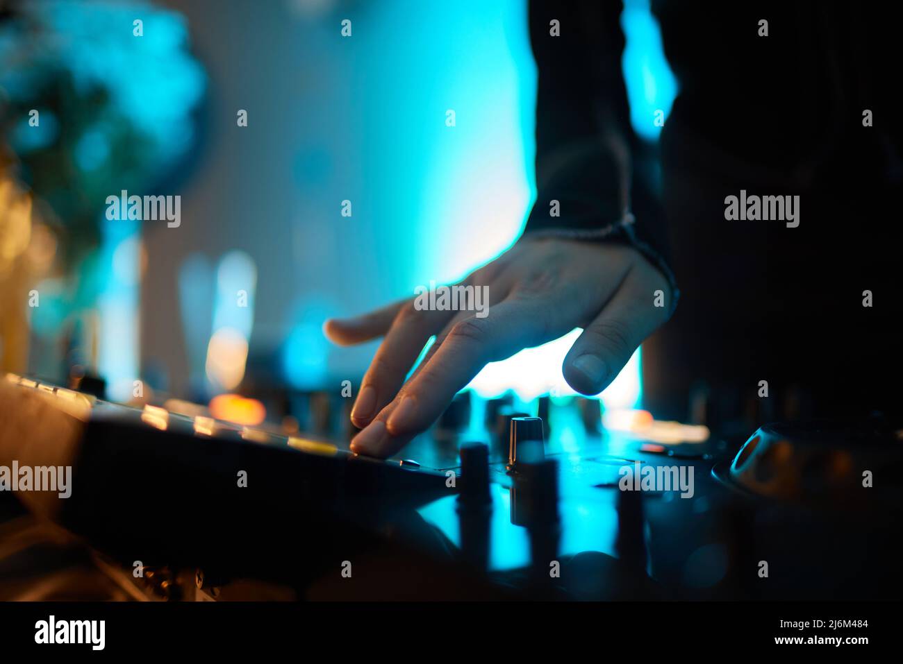 Hands of female Dj playing music on modern midi controller turntable ...