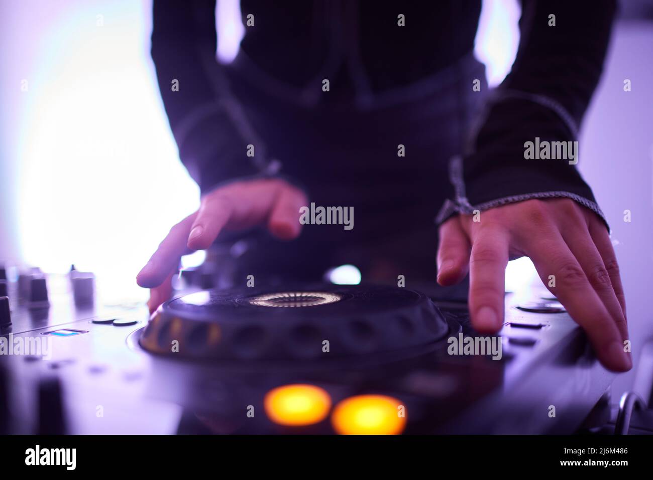 Hands of female Dj playing music on modern midi controller turntable ...