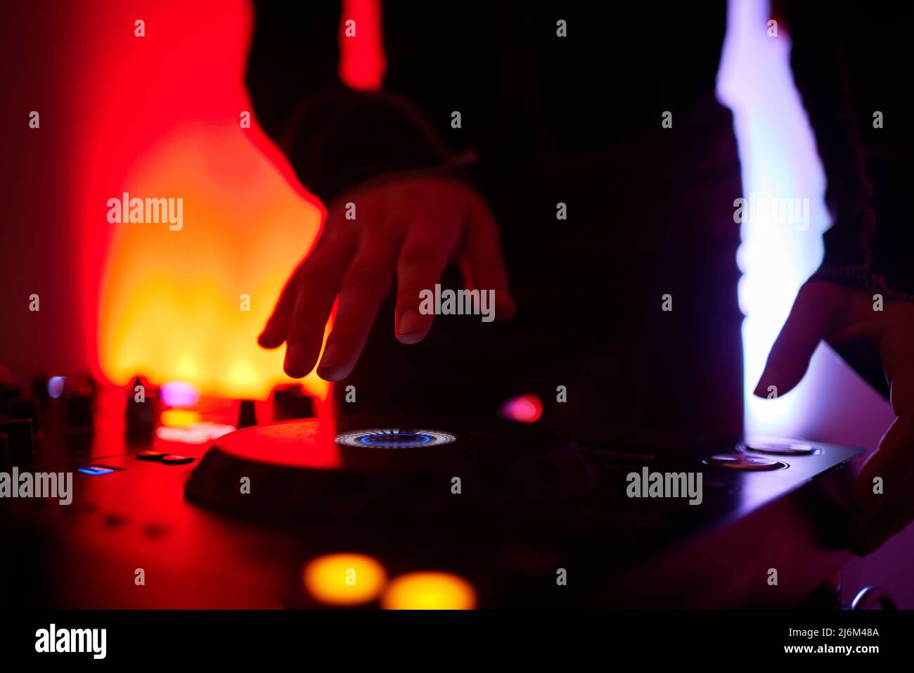 Hands of female Dj playing music on modern midi controller turntable ...