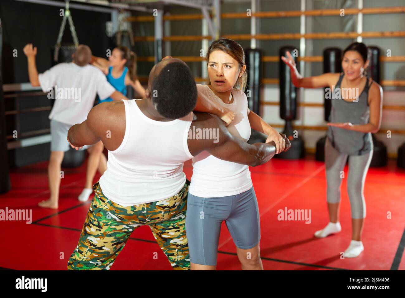 Men and women exercising during self-defence training Stock Photo - Alamy