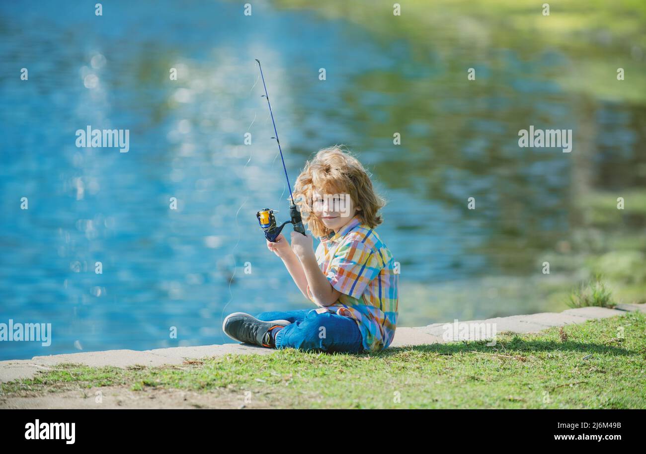 Fishing kid. Boy with spinner at river. Kid at jetty with rod Stock ...