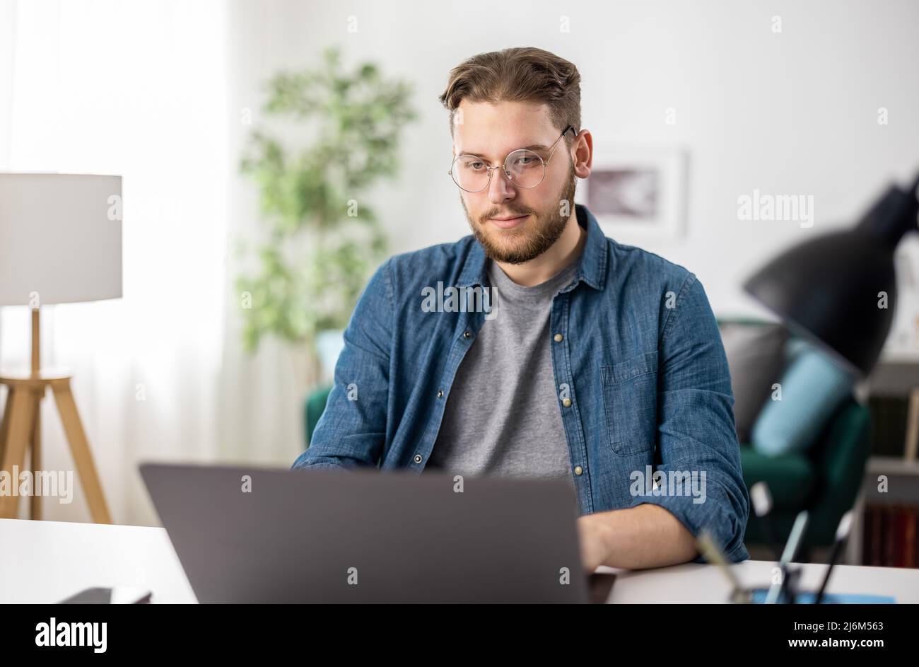 Pensive caucasian man sitting home hi-res stock photography and images ...
