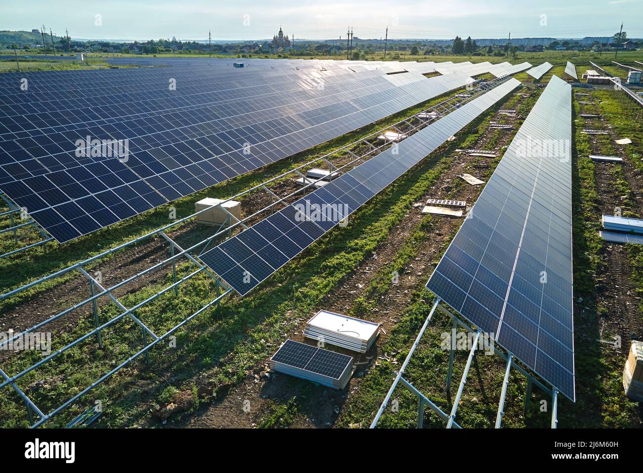 Aerial view of big electric power plant under construction with many ...