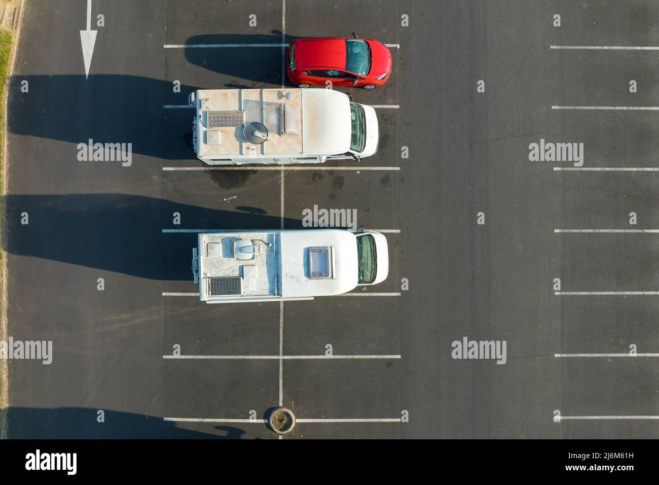 Aerial view of camper vans parked on parking lot Stock Photo - Alamy