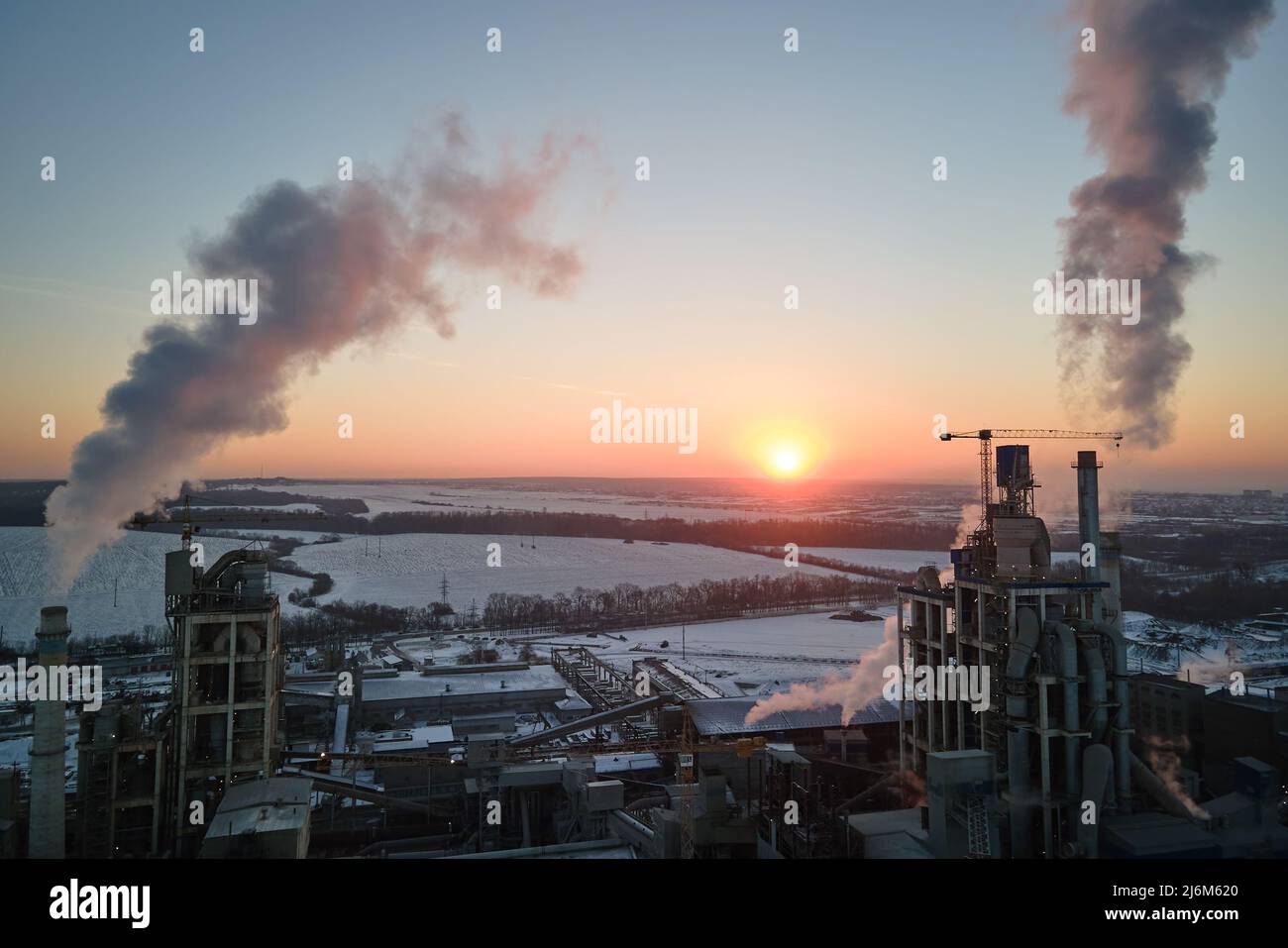 Aerial view of cement factory tower with high concrete plant structure ...