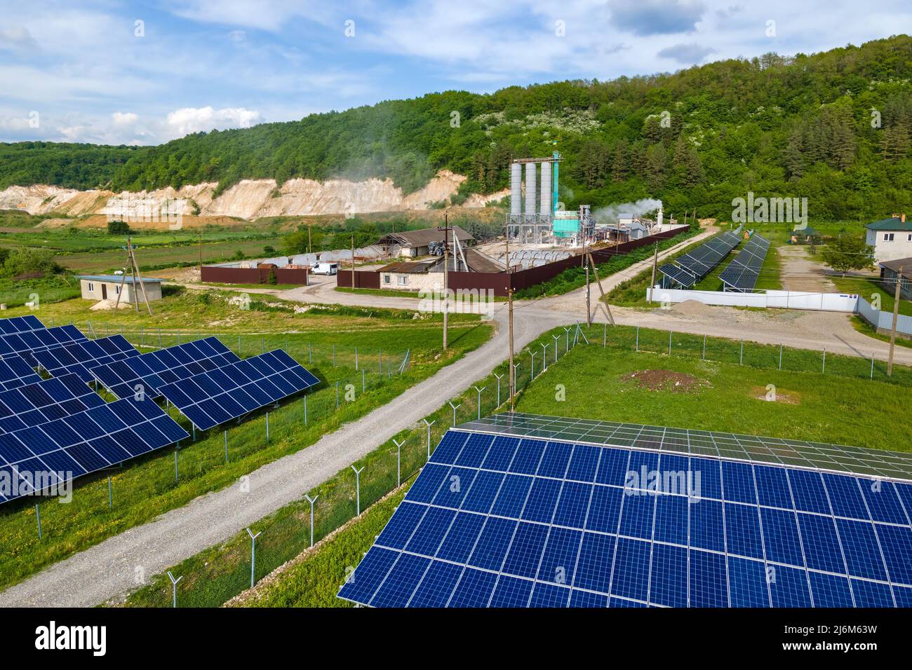 Aerial view of electrical power plant with rows of solar photovoltaic ...
