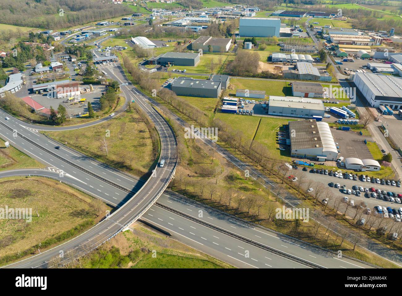Aerial view of highway road intersection with fast moving heavy traffic ...